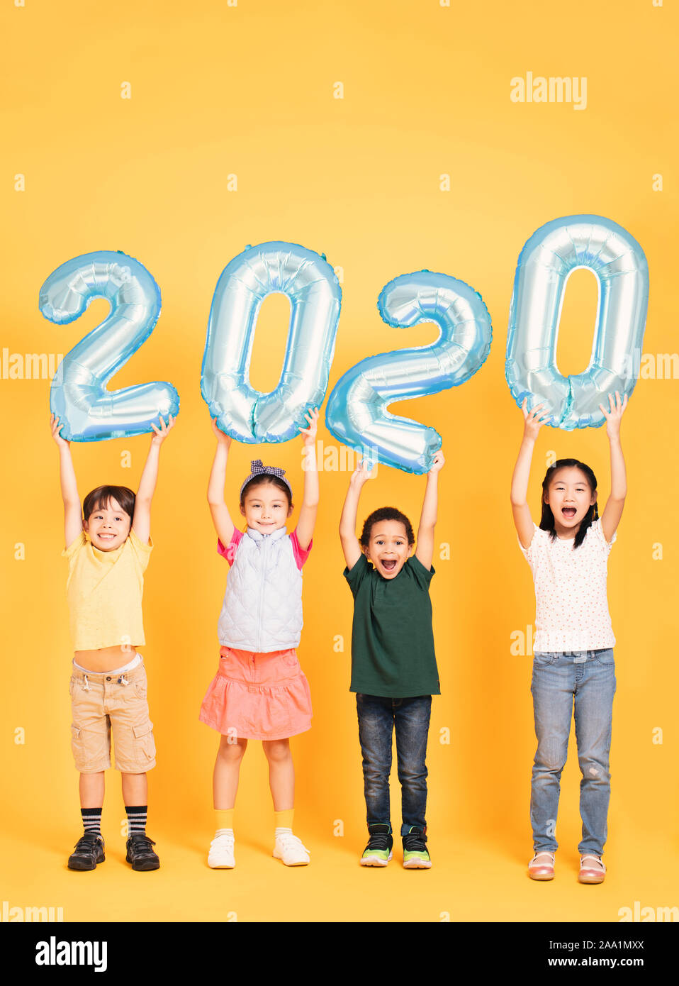 Group of happy kids celebrating and showing 2020 new year concepts ...