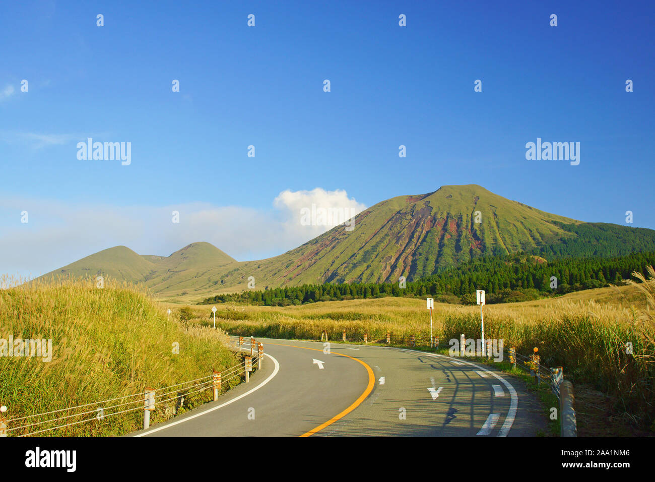 Mountain road on Mt. Aso, autumn Stock Photo - Alamy