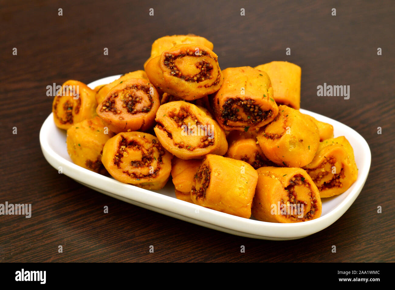 Bhakarwadi or Bakarwadi or spring roll, traditional sweet and spicy ...