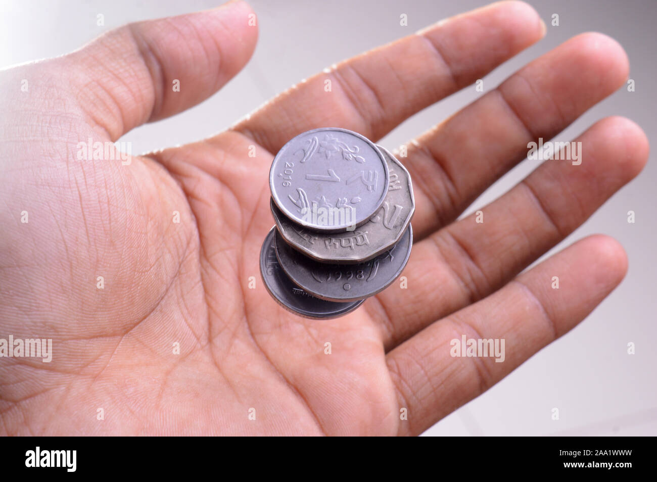 Floating change on hand Stock Photo - Alamy