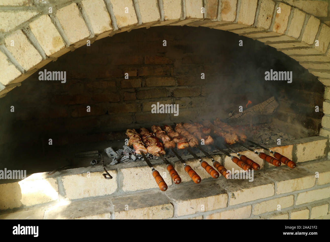 Khorovats or Armenian Barbecue Being Grilled on a Large Clay Oven Stock ...