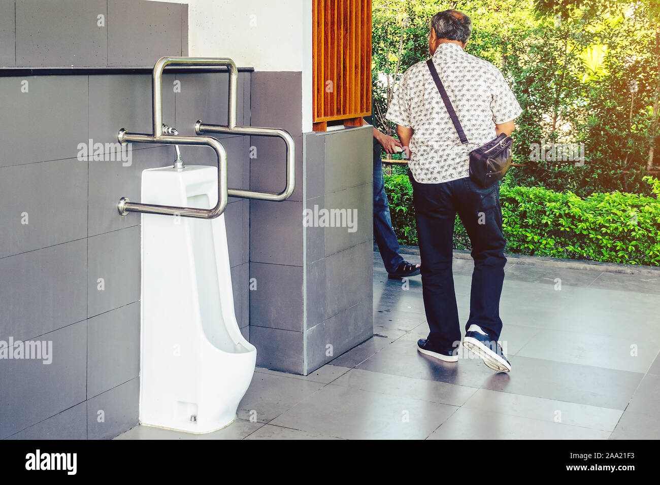 Clean and modern public men toilet with friendly design for people with ...