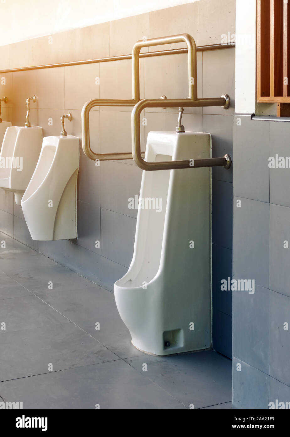 Clean and modern public men toilet with friendly design for people with ...