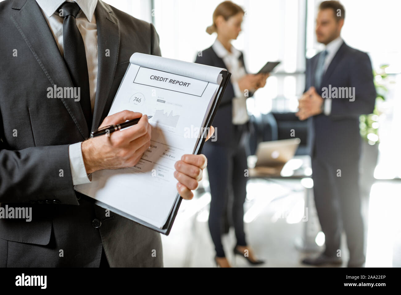 Bank employee with some statistics report at the bank office with ...