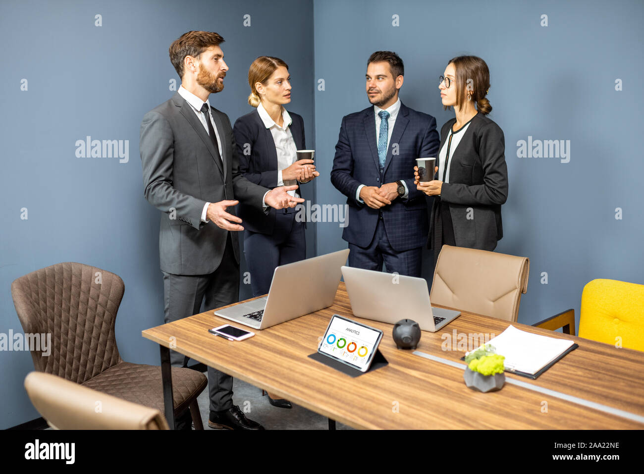 Business people having informal discussion during a coffee break in the ...