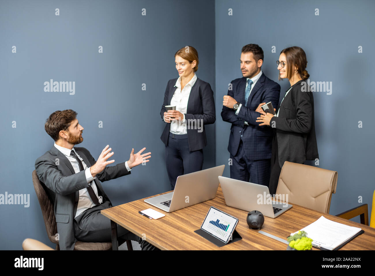 Business people having informal discussion during a coffee break in the ...