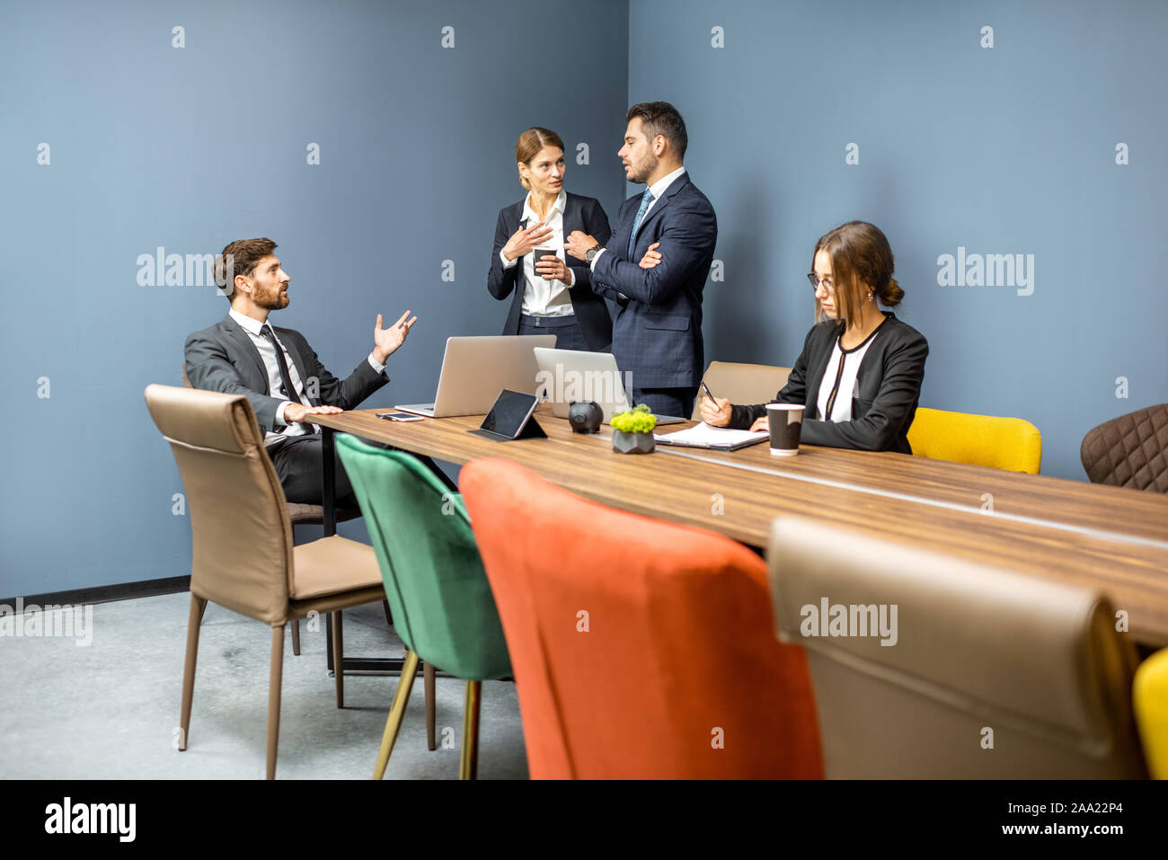 Business people having informal discussion during a coffee break in the ...