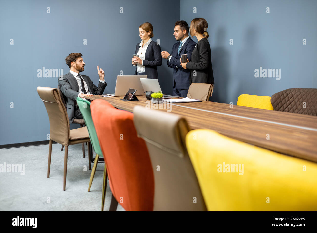 Business people having informal discussion during a coffee break in the ...