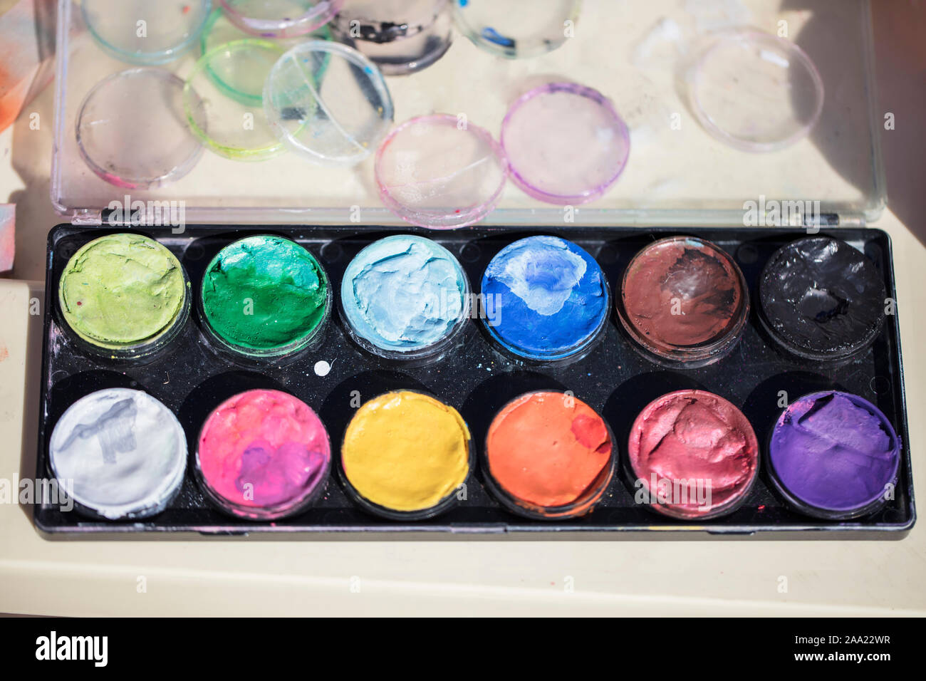 Multi-colored watercolor paints. A palette of different colors for face ...