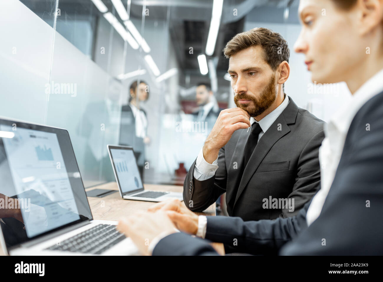 White-collar employees working on the laptop at the working place in ...
