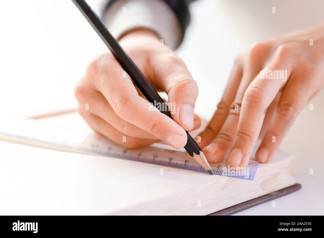 Draw a line with a ruler Stock Photo - Alamy