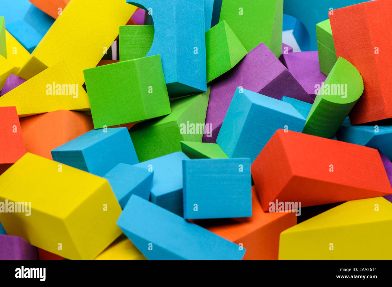 Different shape wooden toy blocks. Colorful background of red, yellow ...