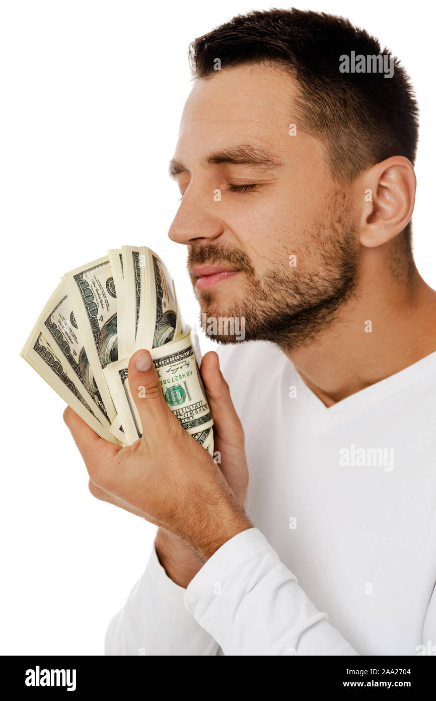 Portrait of young man holding money banknotes isolated on white ...