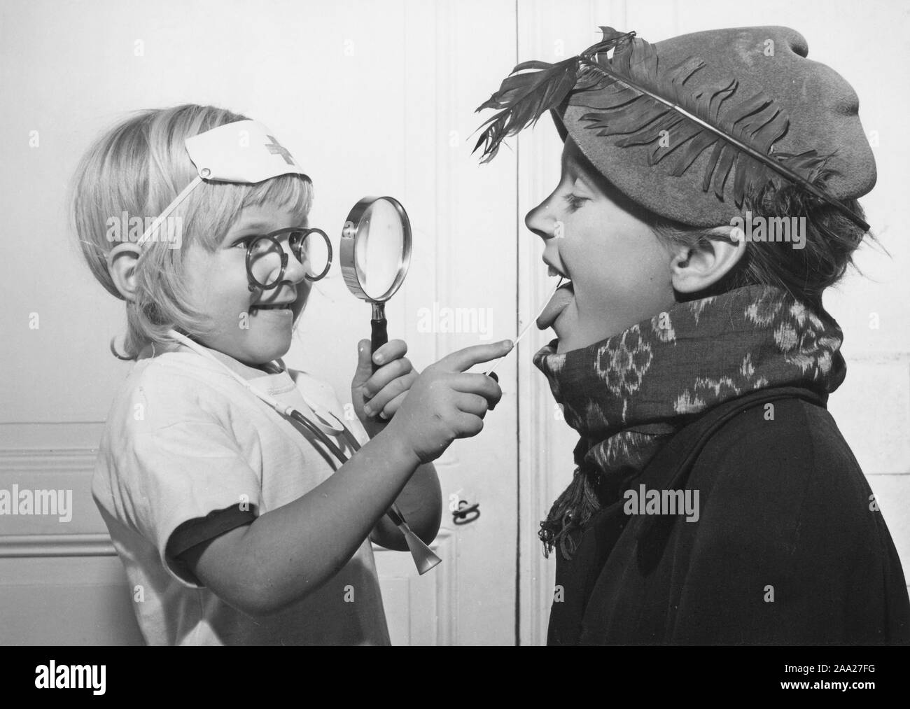 Playing doctor in the 1940s. A little girl is the doctor in this game ...