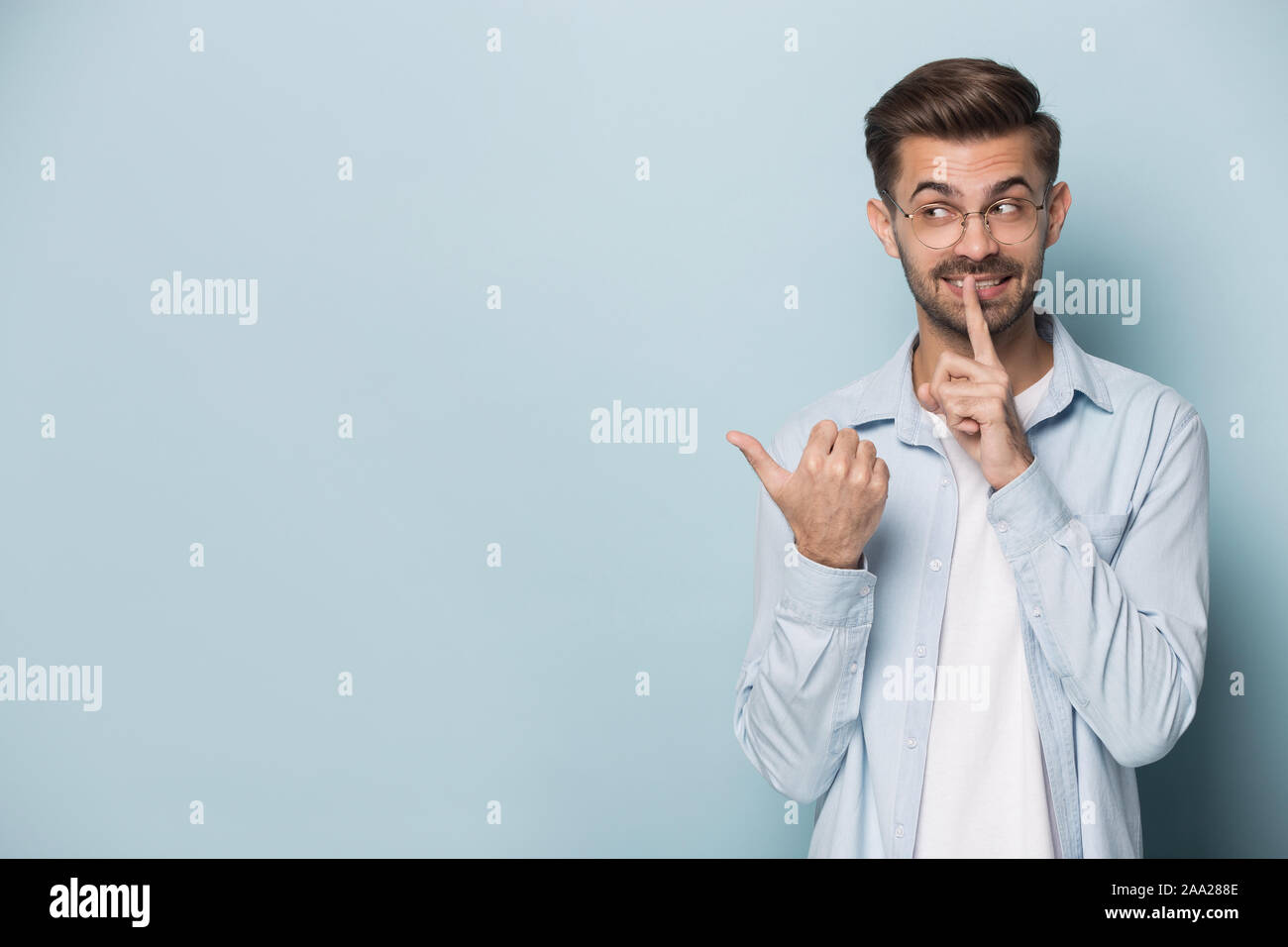 Keep silence gesture young man hi-res stock photography and images - Alamy
