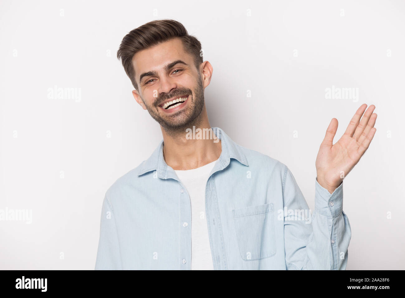 Happy client waving hand in greeting gesture Stock Photo - Alamy