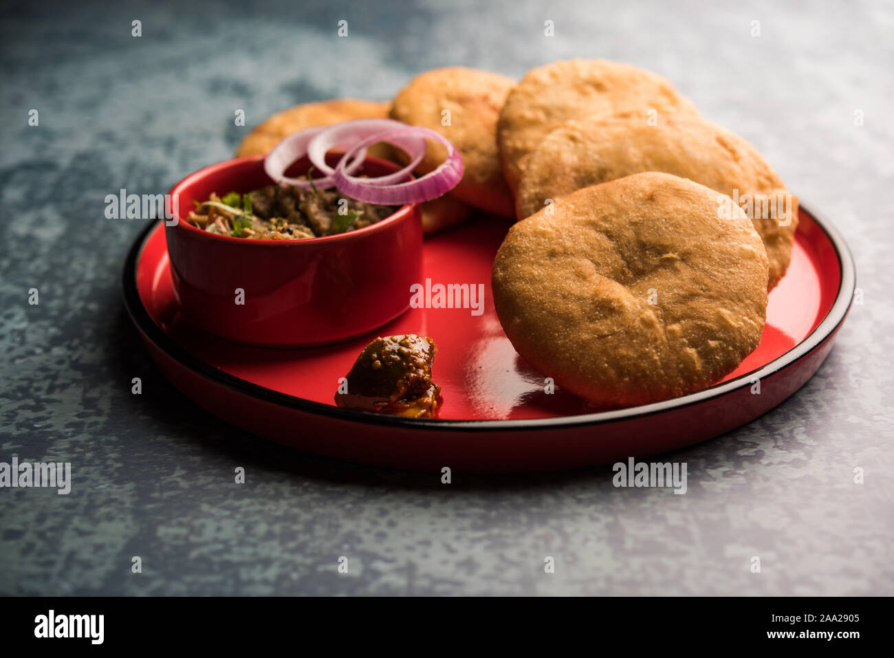 Fried Sattu Litti chokha served with Baingan Bharta, onion and pickle ...