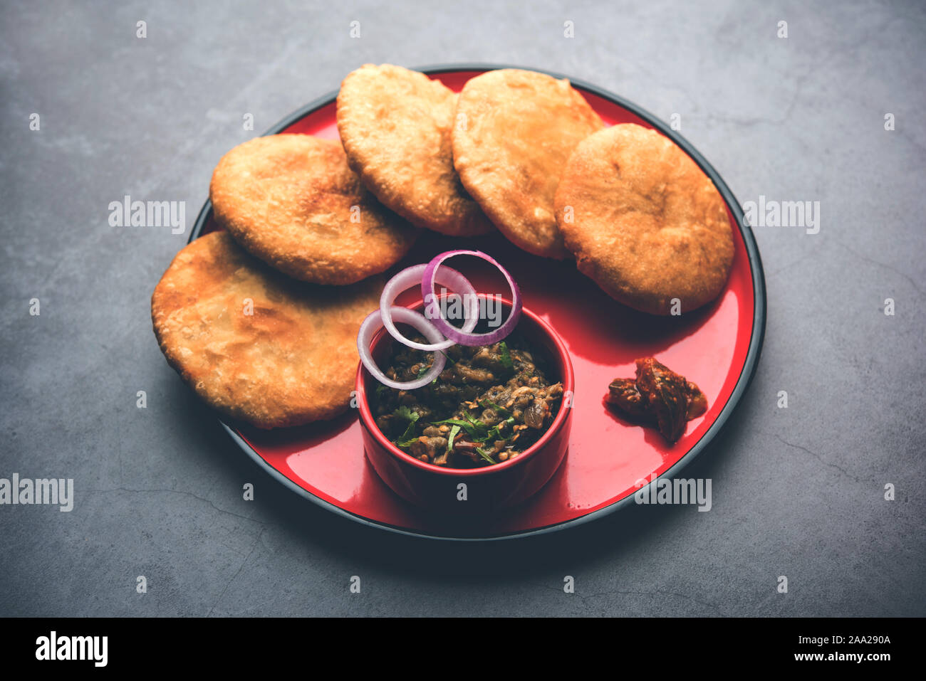 Fried Sattu Litti chokha served with Baingan Bharta, onion and pickle ...