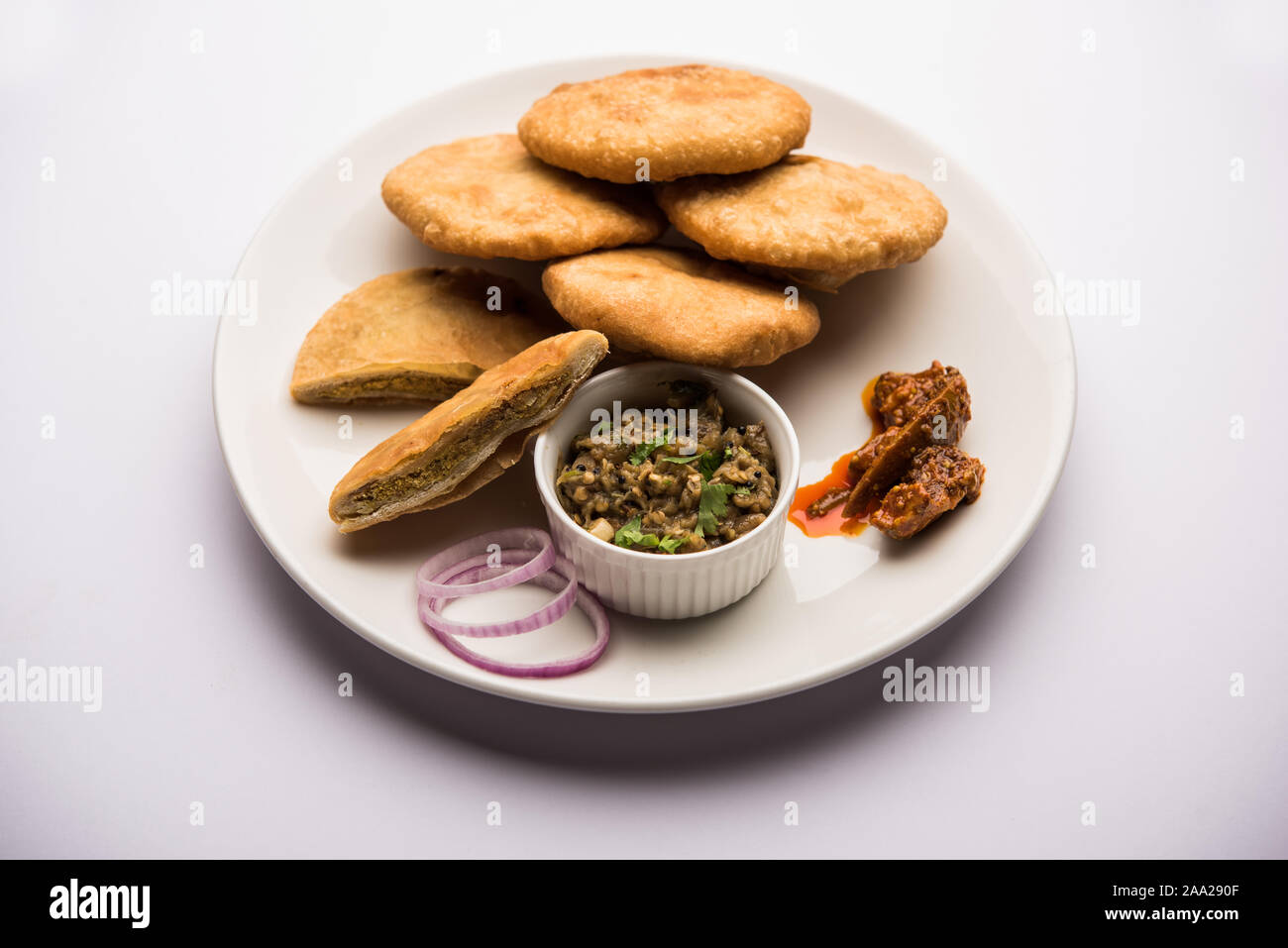 Fried Sattu Litti chokha served with Baingan Bharta, onion and pickle ...