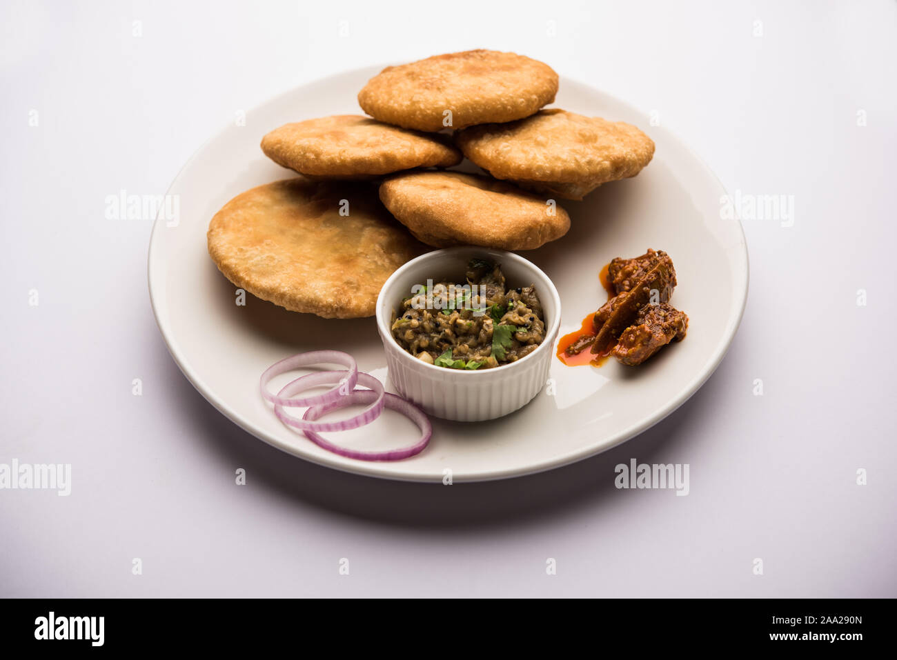 Fried Sattu Litti chokha served with Baingan Bharta, onion and pickle ...