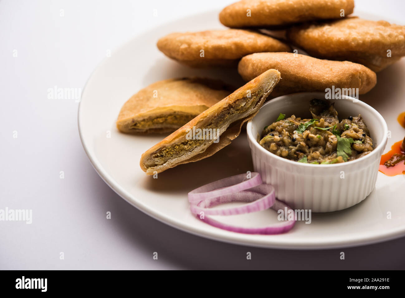 Fried Sattu Litti chokha served with Baingan Bharta, onion and pickle ...