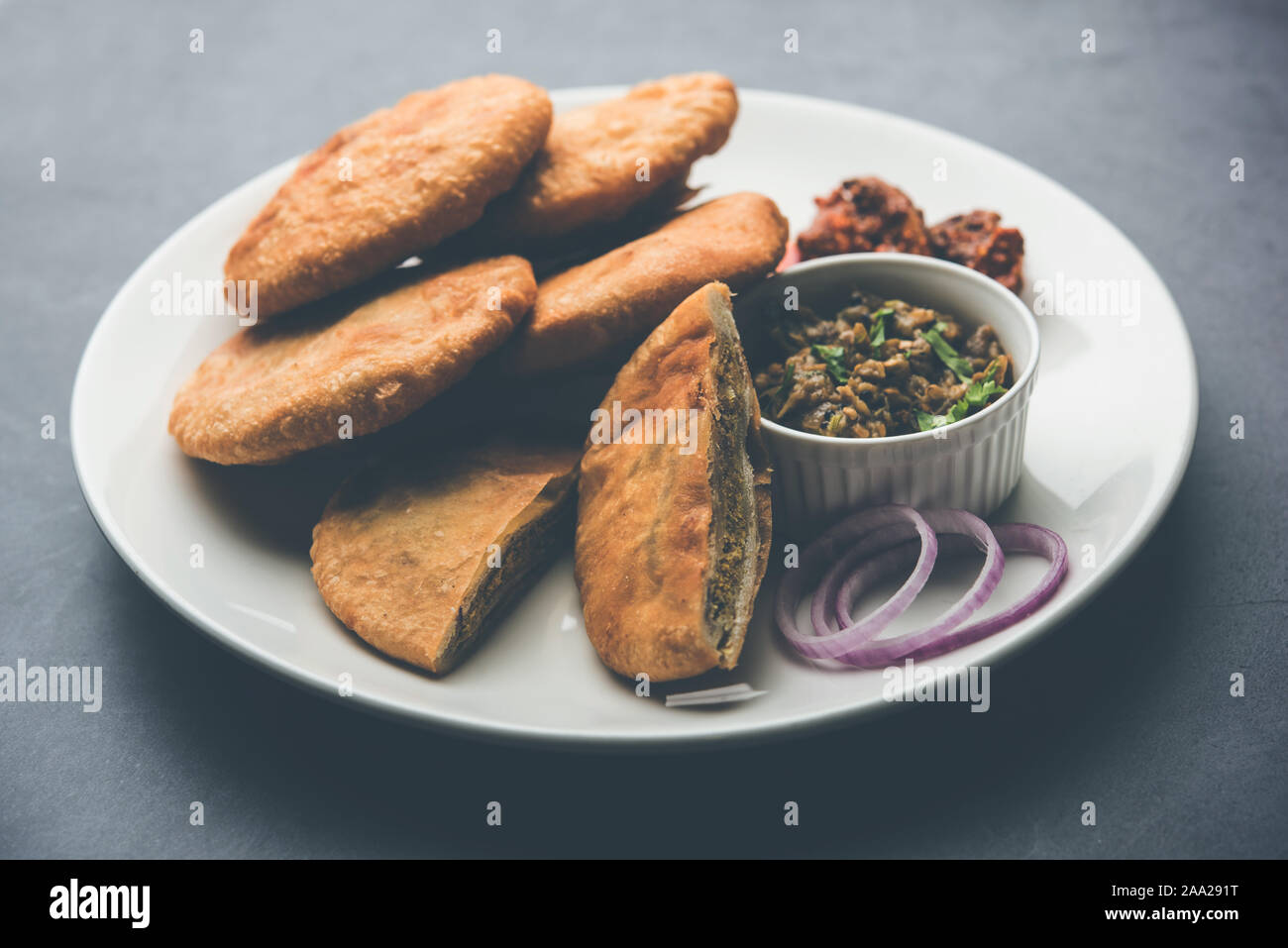 Fried Sattu Litti chokha served with Baingan Bharta, onion and pickle ...