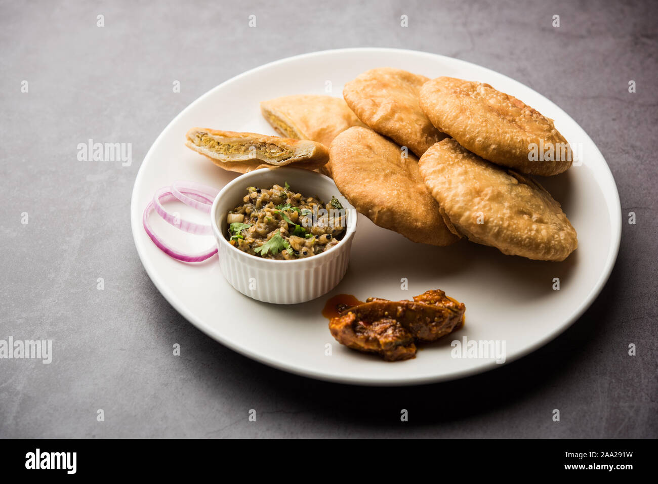 Fried Sattu Litti chokha served with Baingan Bharta, onion and pickle ...