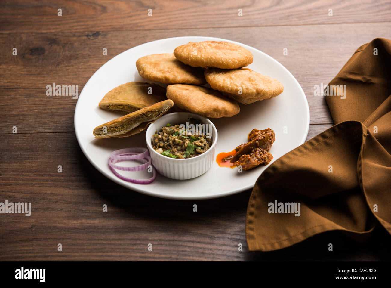 Fried Sattu Litti chokha served with Baingan Bharta, onion and pickle ...