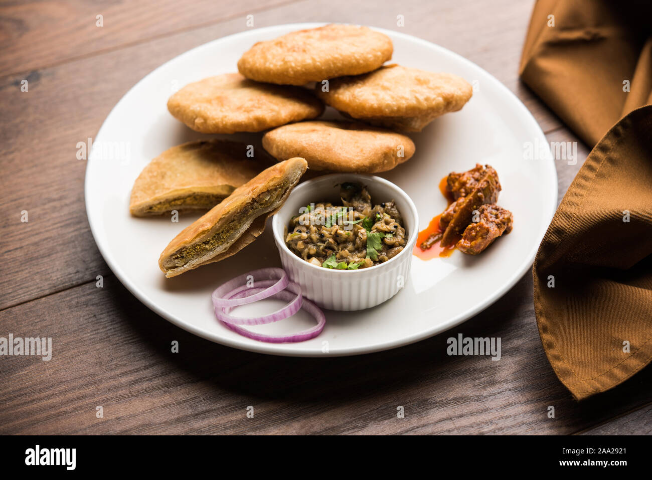Fried Sattu Litti chokha served with Baingan Bharta, onion and pickle ...