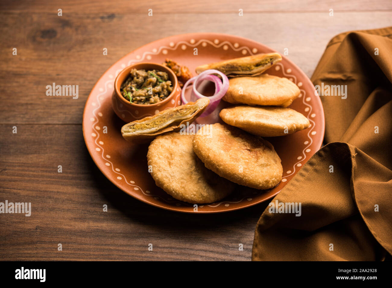 Fried Sattu Litti chokha served with Baingan Bharta, onion and pickle ...