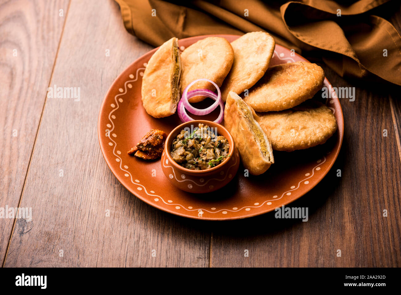 Fried Sattu Litti chokha served with Baingan Bharta, onion and pickle ...