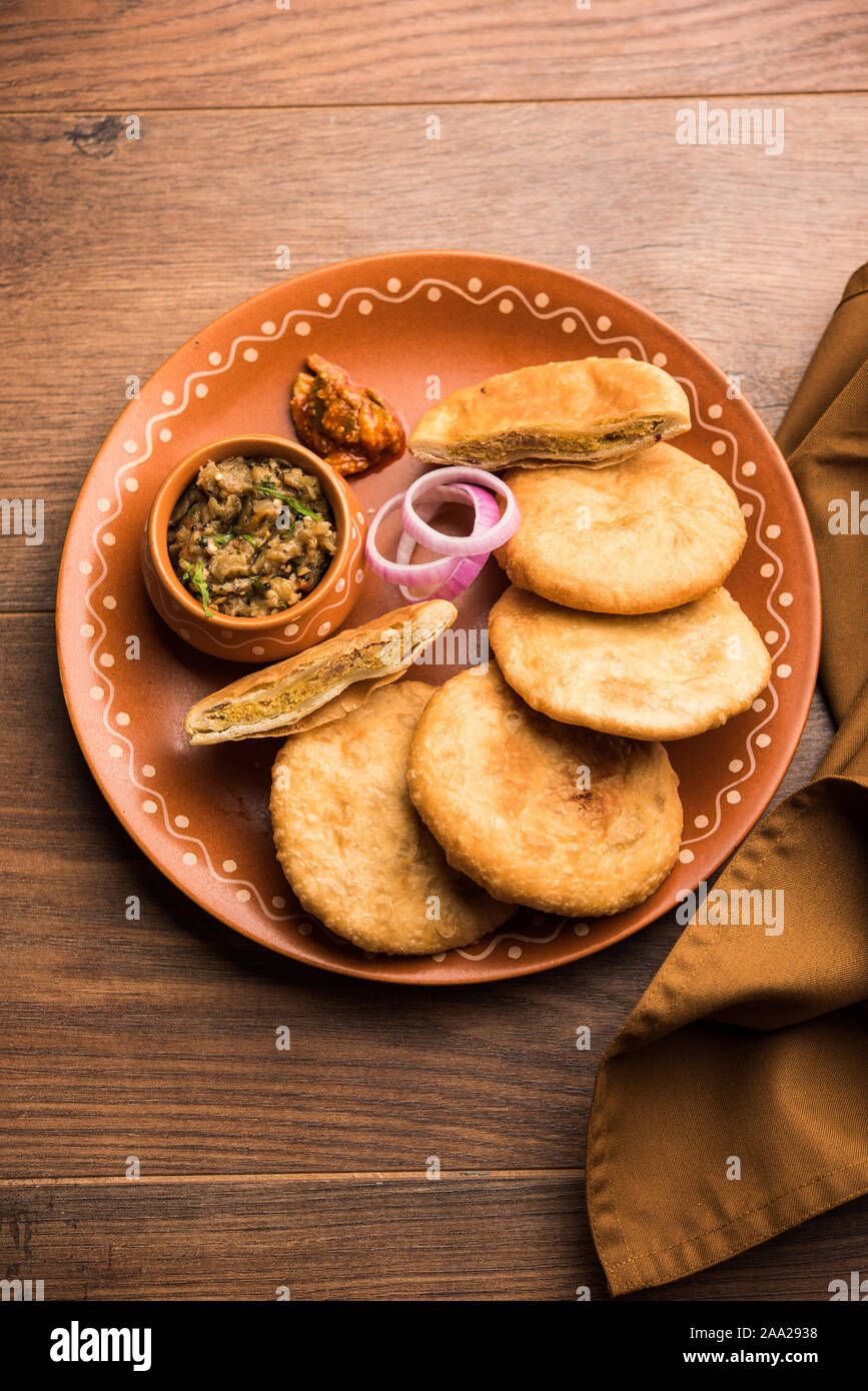 Fried Sattu Litti chokha served with Baingan Bharta, onion and pickle ...