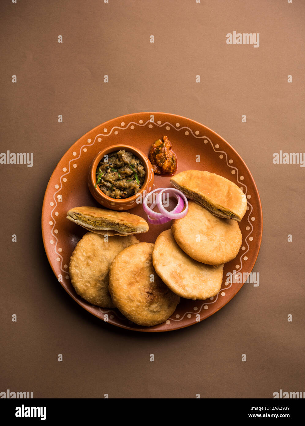 Fried Sattu Litti chokha served with Baingan Bharta, onion and pickle ...