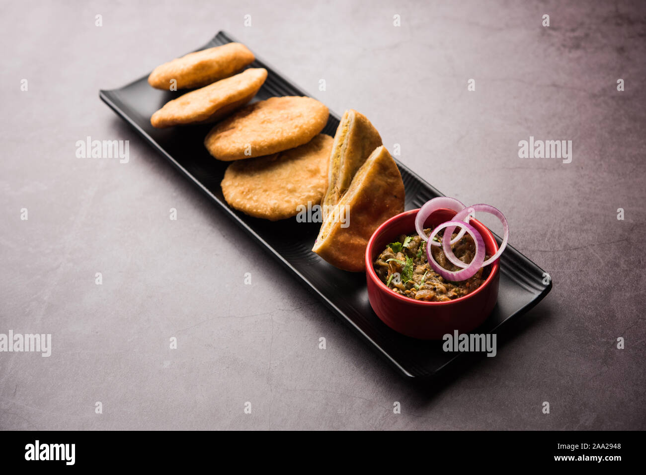 Fried Sattu Litti chokha served with Baingan Bharta, onion and pickle ...