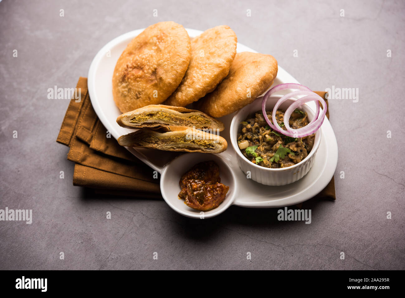 Fried Sattu Litti chokha served with Baingan Bharta, onion and pickle ...
