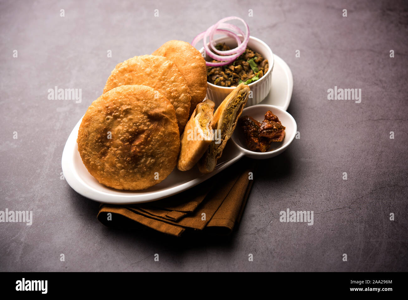 Fried Sattu Litti chokha served with Baingan Bharta, onion and pickle ...
