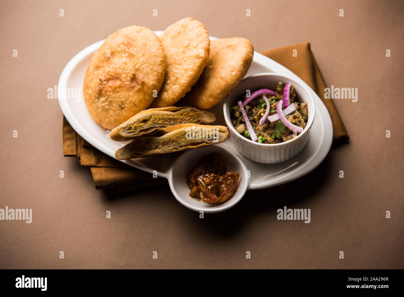 Fried Sattu Litti chokha served with Baingan Bharta, onion and pickle ...