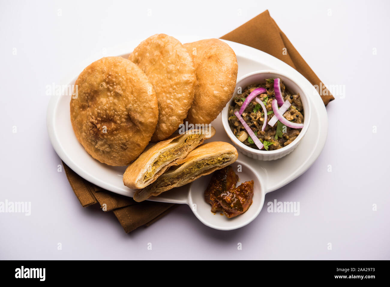 Fried Sattu Litti chokha served with Baingan Bharta, onion and pickle ...