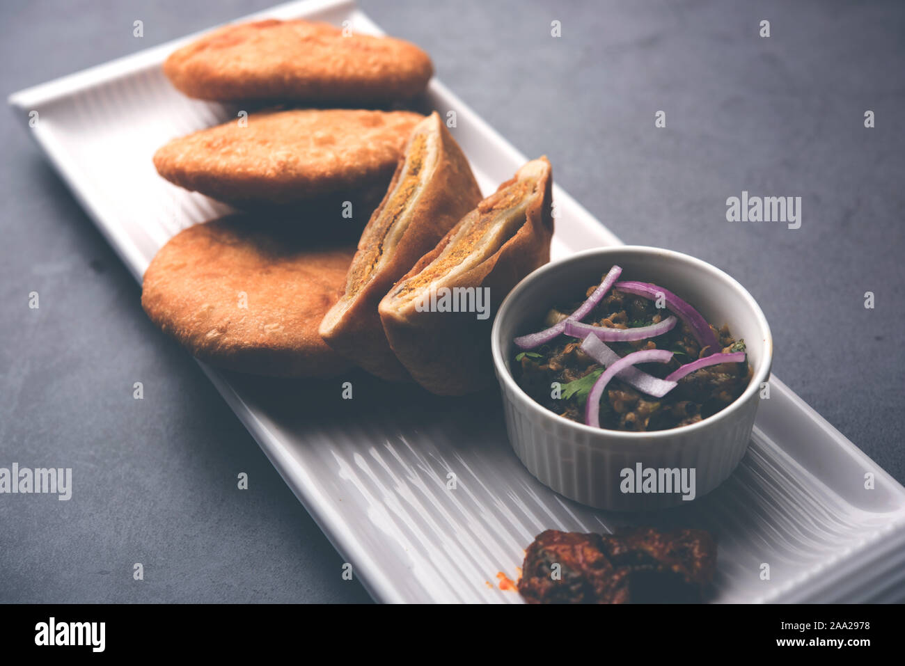 Fried Sattu Litti chokha served with Baingan Bharta, onion and pickle ...