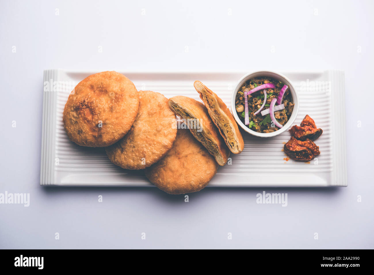 Fried Sattu Litti chokha served with Baingan Bharta, onion and pickle ...