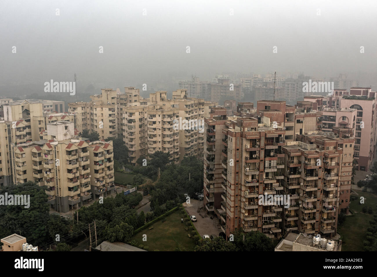 The Delhi smog lies over apartment blocks in Gurgaon Sector 55 reducing ...