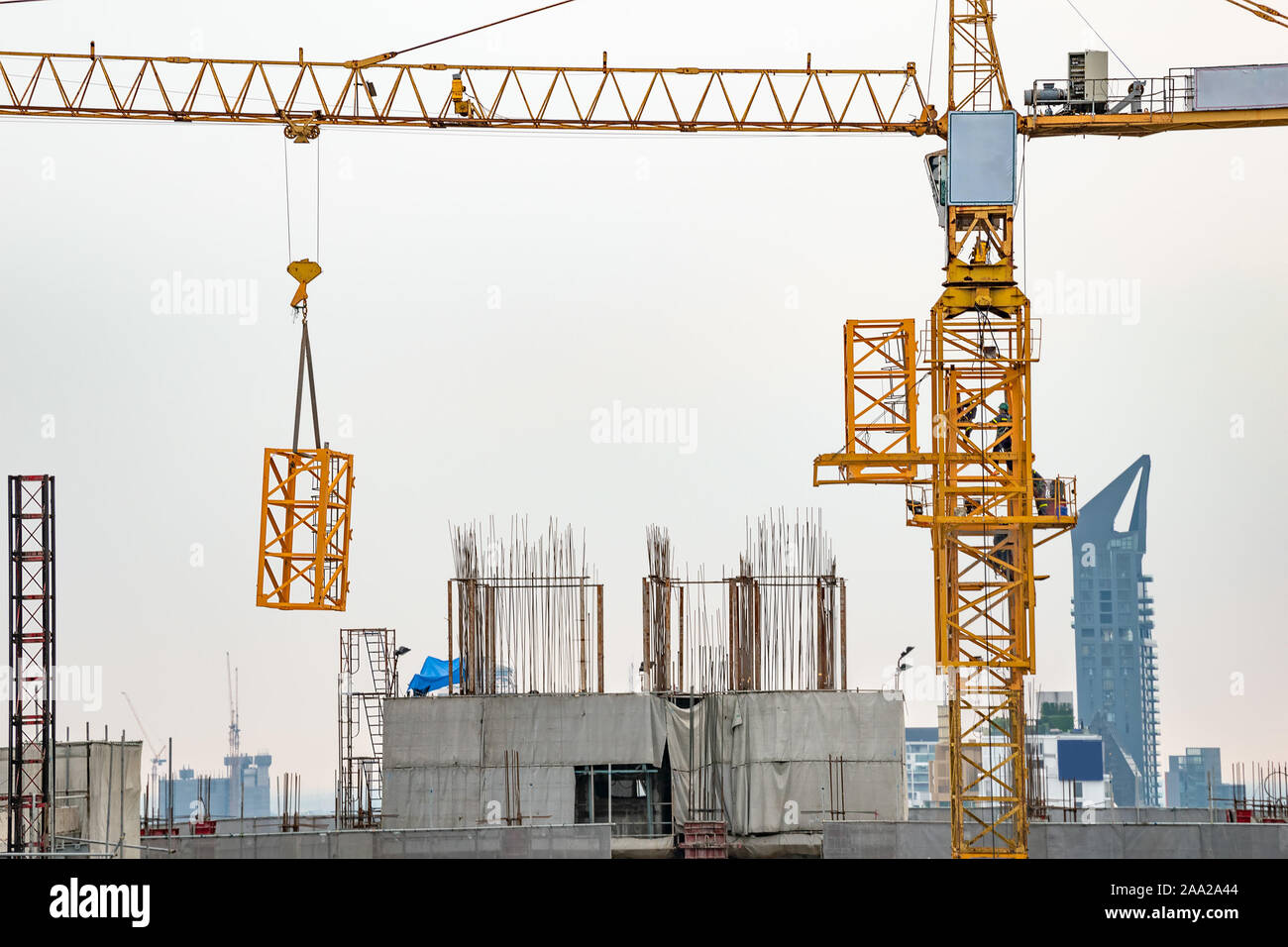 Aerial view of a building construction with tower crane, scaffolding ...