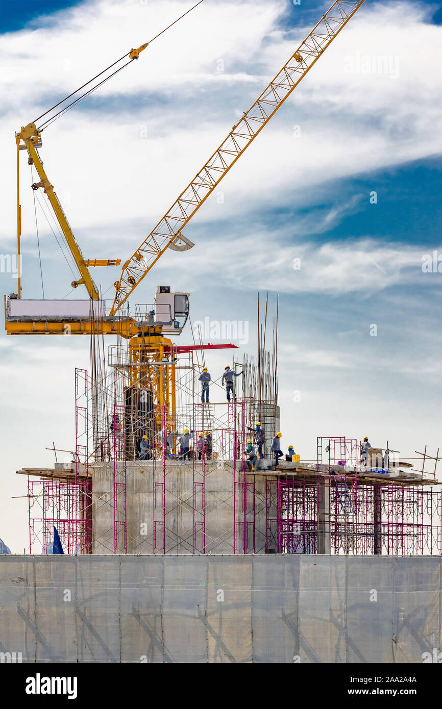 Aerial view of a building construction with tower crane, scaffolding ...