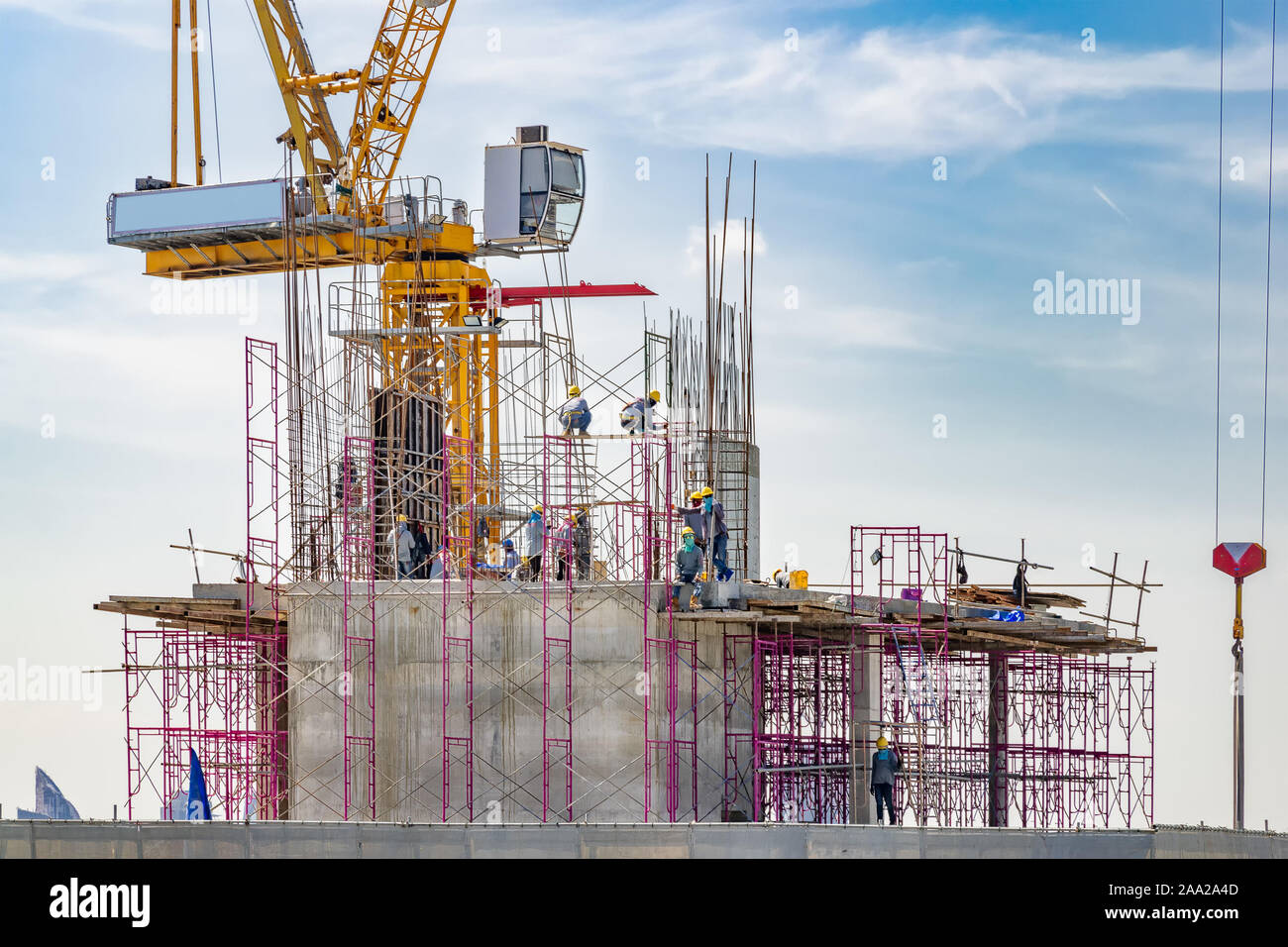 Aerial view of a building construction with tower crane, scaffolding ...