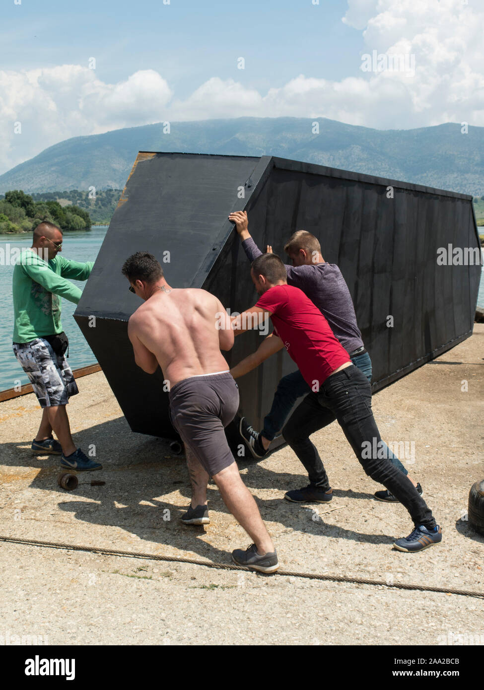 Men turning a barge up and down Stock Photo - Alamy