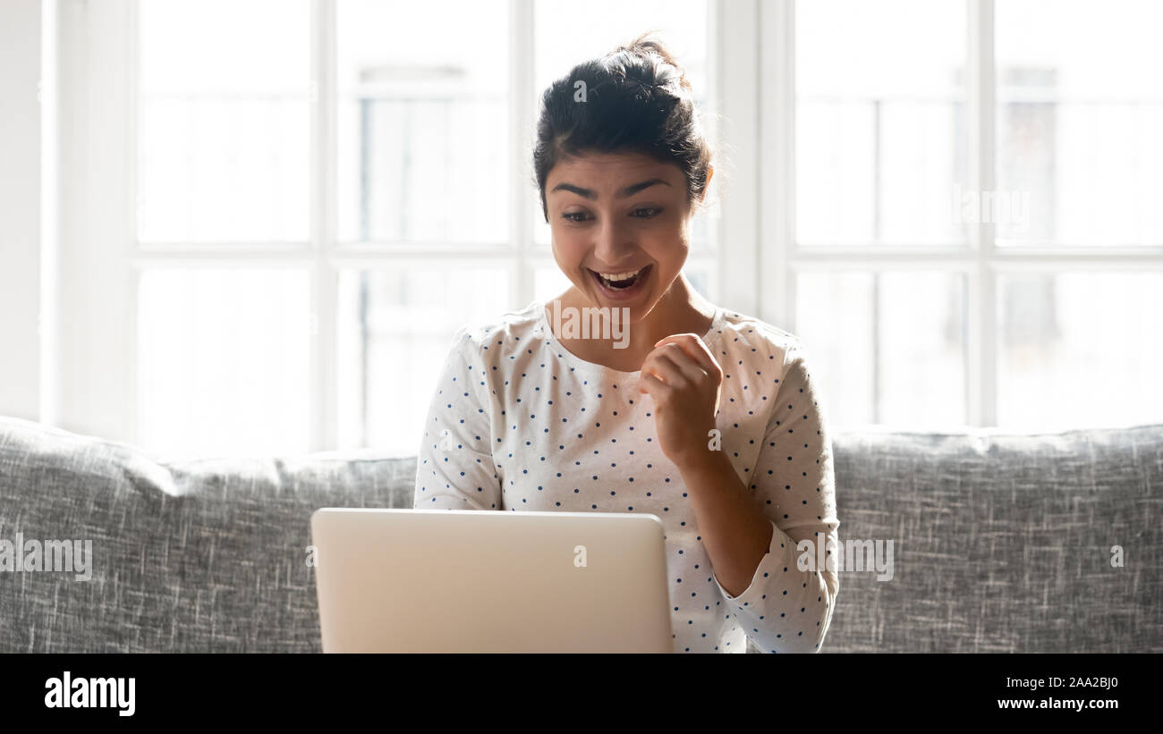 Happy indian woman reading email with great news on computer Stock ...