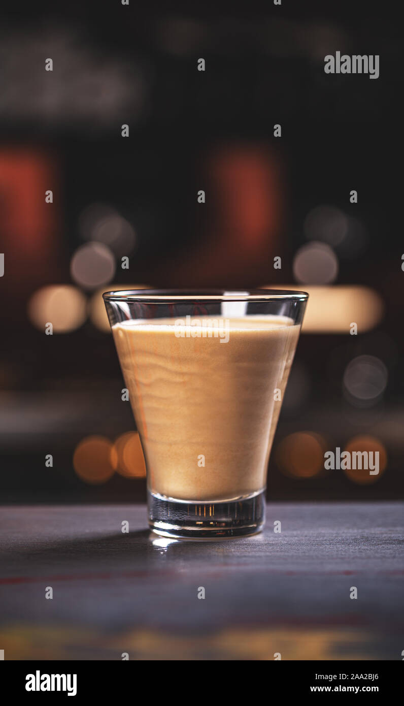 Glass of coffee latte in coffee shop counter Stock Photo - Alamy