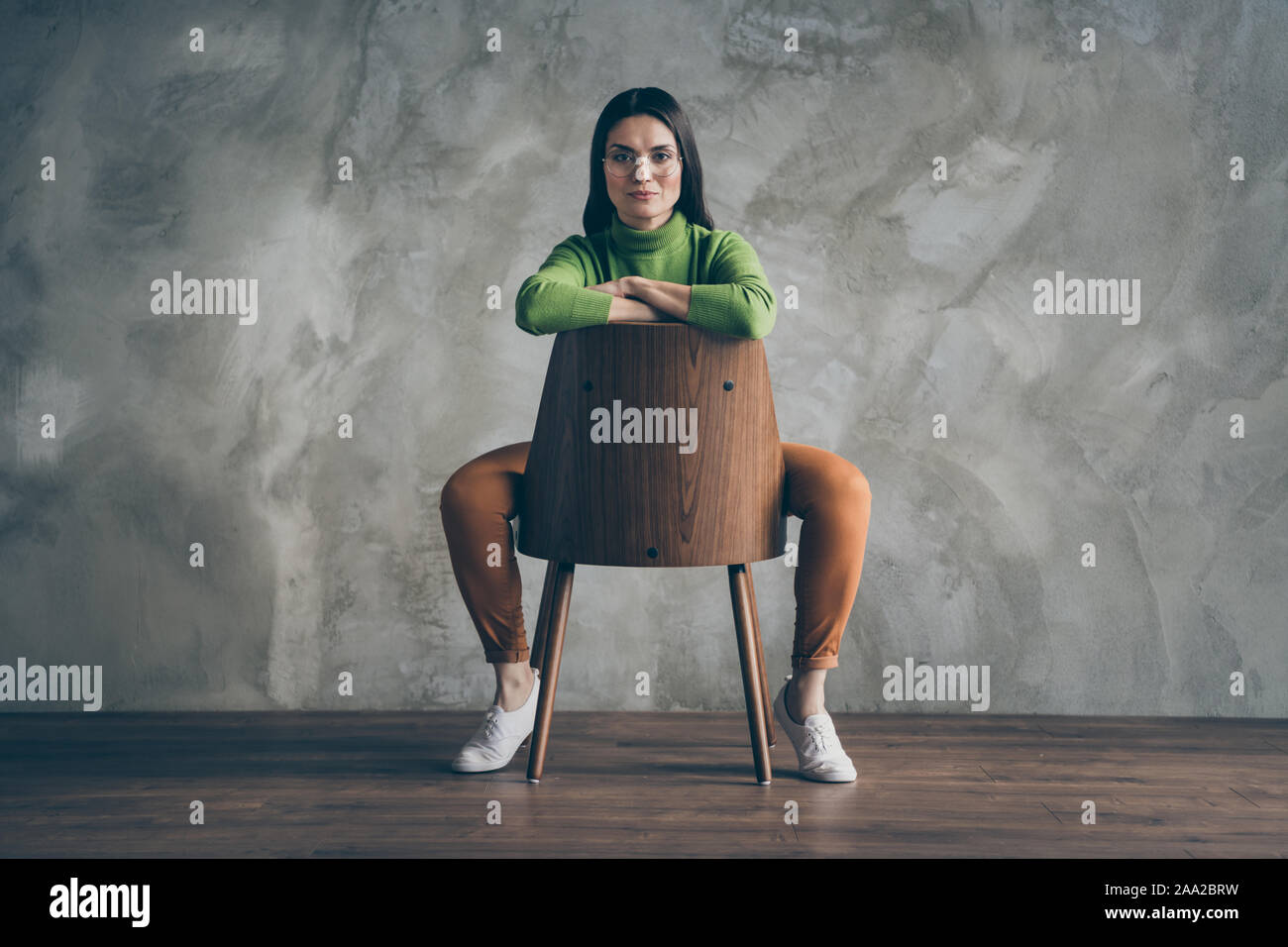Full length body size photo of confident woman sitting in chair turned ...