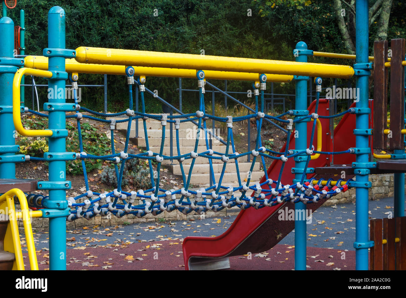 Game with slide and net in a children's play area Stock Photo - Alamy