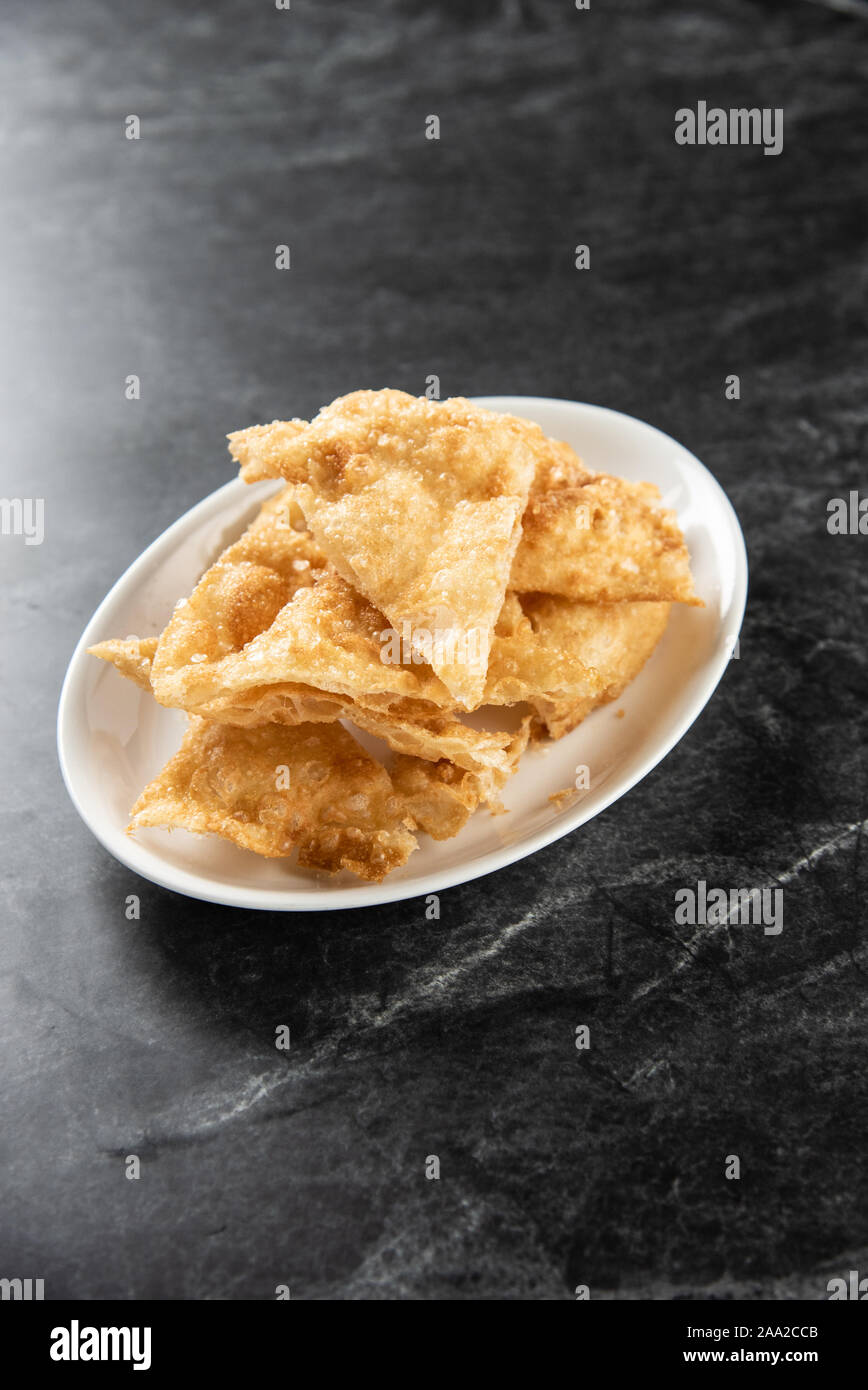 fried crispy roti dough , crispy Roti Indian food made of flour on dish ...